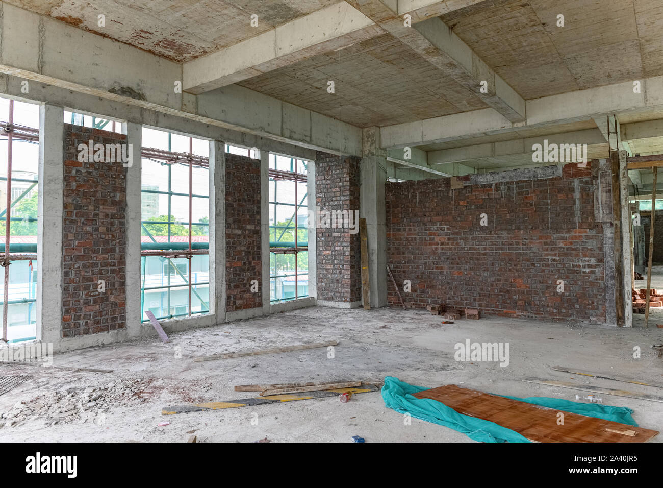 inside of an unfinished building with protection scaffolding and ...