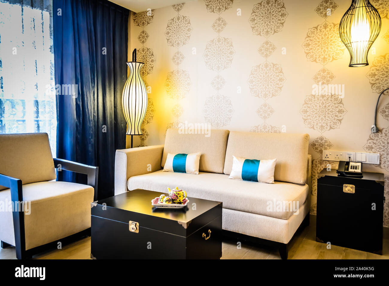 beautiful sitting room with peranakan design elements and couches and ...