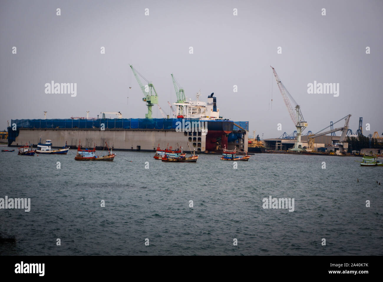 View of the shipyard, shipyard, crane, gantry and cargo ship parked in ...