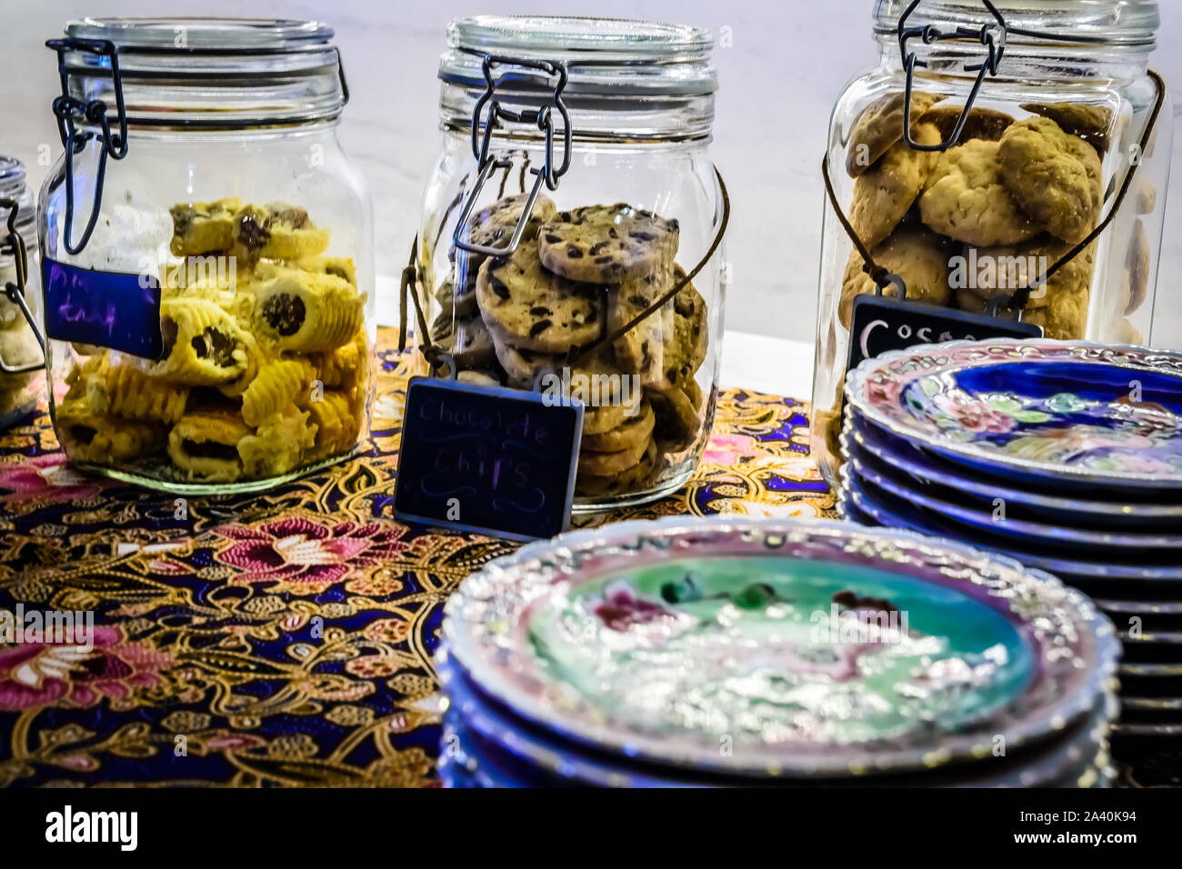 colourful peranakan small dishes on a colourful batik table cloth with ...