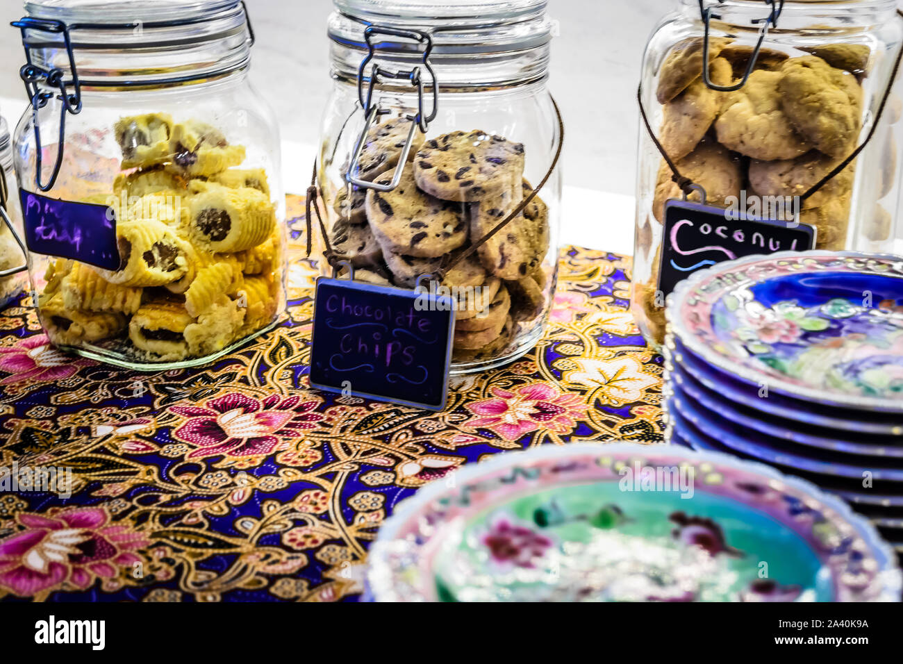 colourful peranakan small dishes on a colourful batik table cloth with ...
