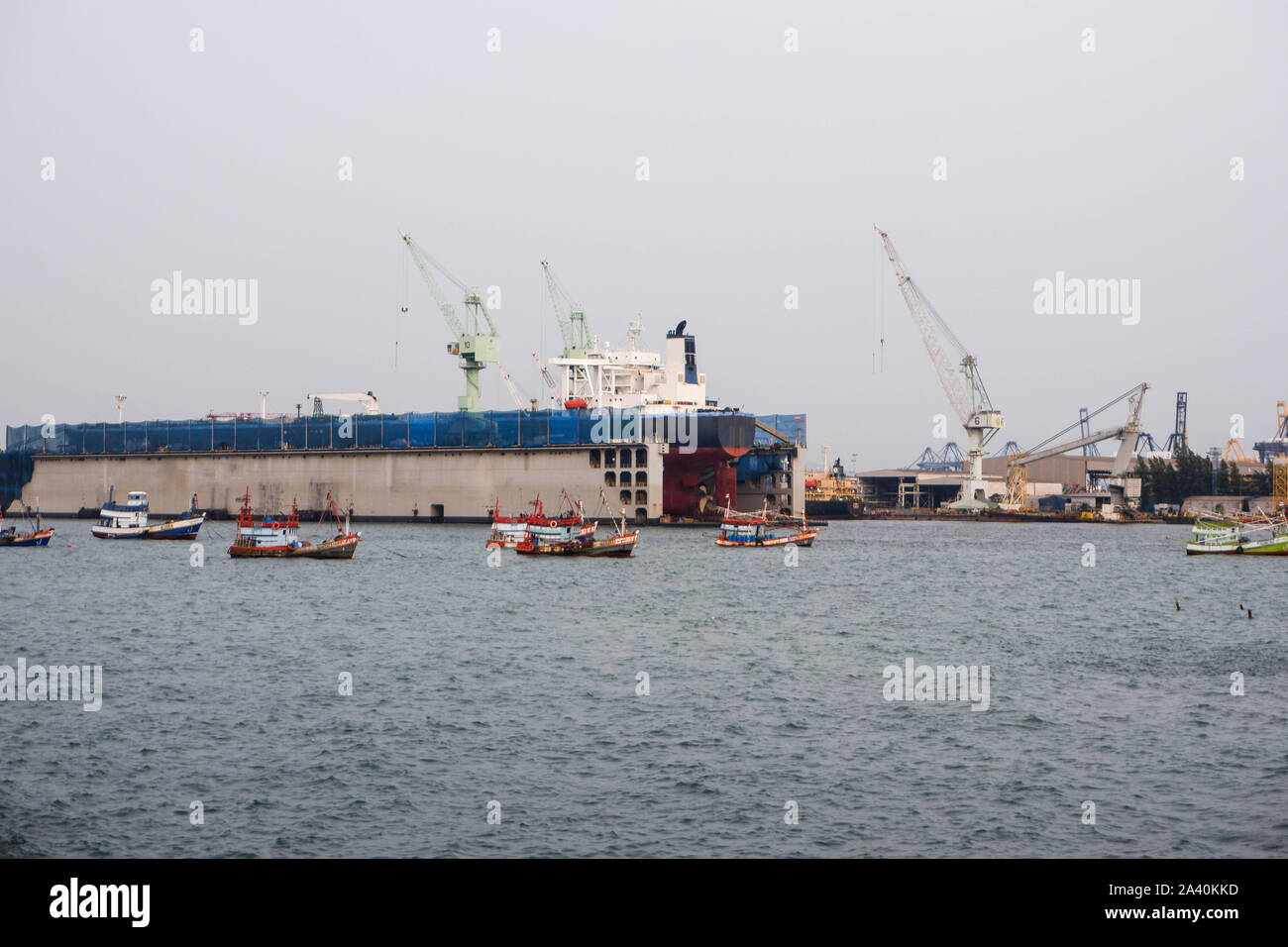 View of the shipyard, shipyard, crane, gantry and cargo ship parked in ...