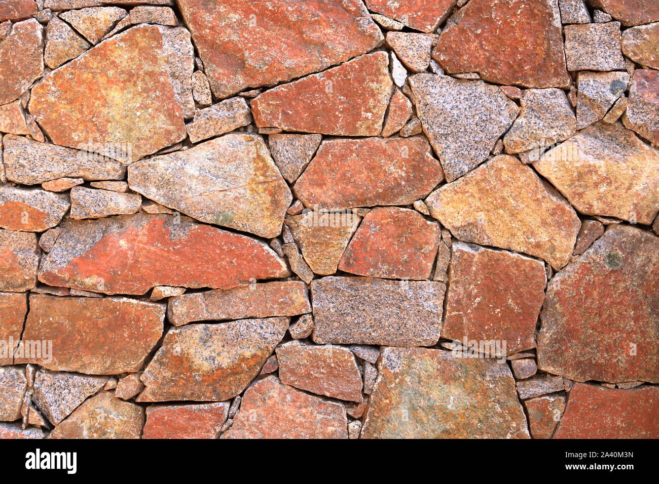 A Pattern of red stone Brick Wall Surfaced Stock Photo - Alamy