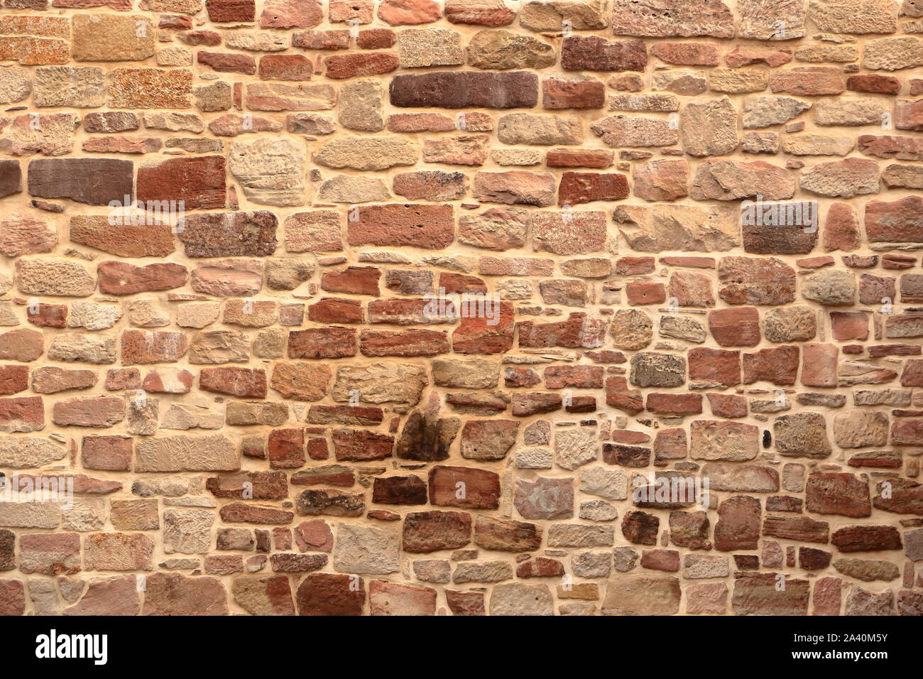 A Pattern of red stone Brick Wall Surfaced Stock Photo - Alamy