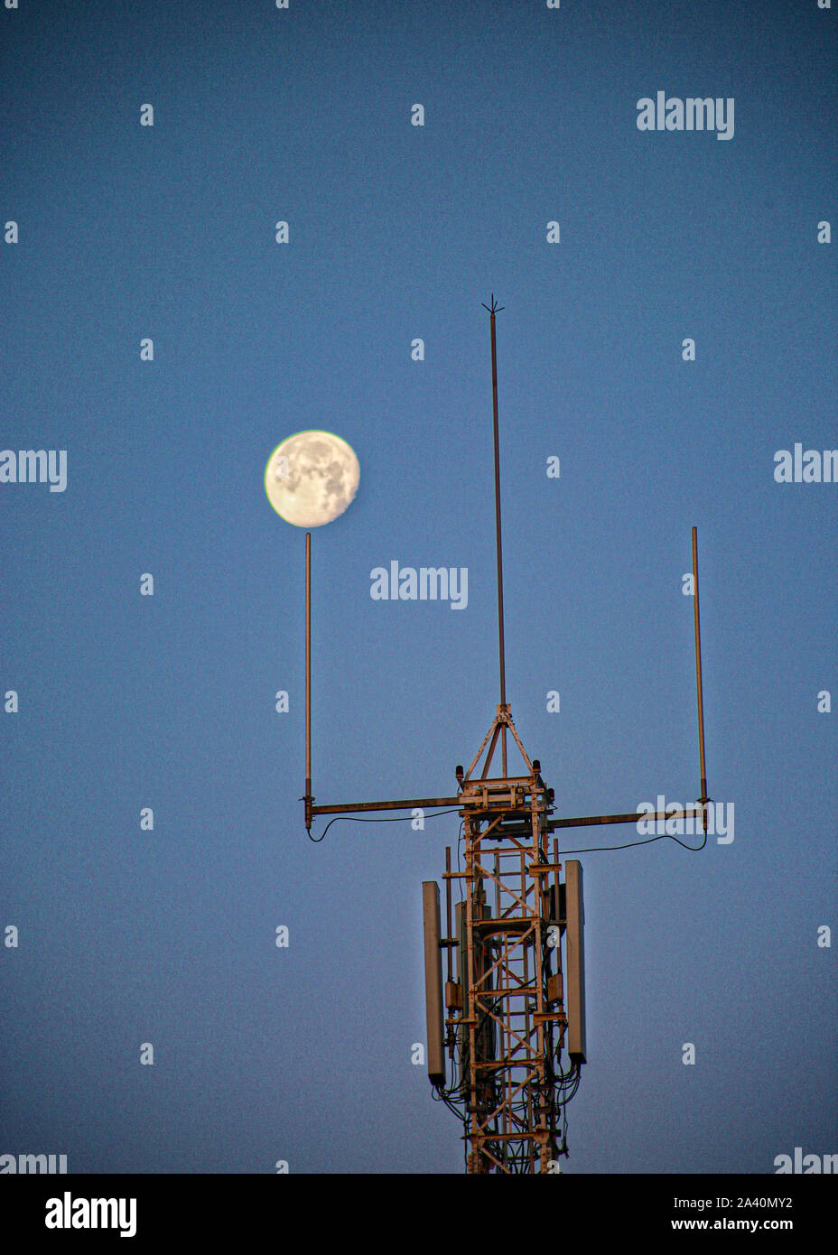 Balancing Act With The Moon Stock Photo - Alamy