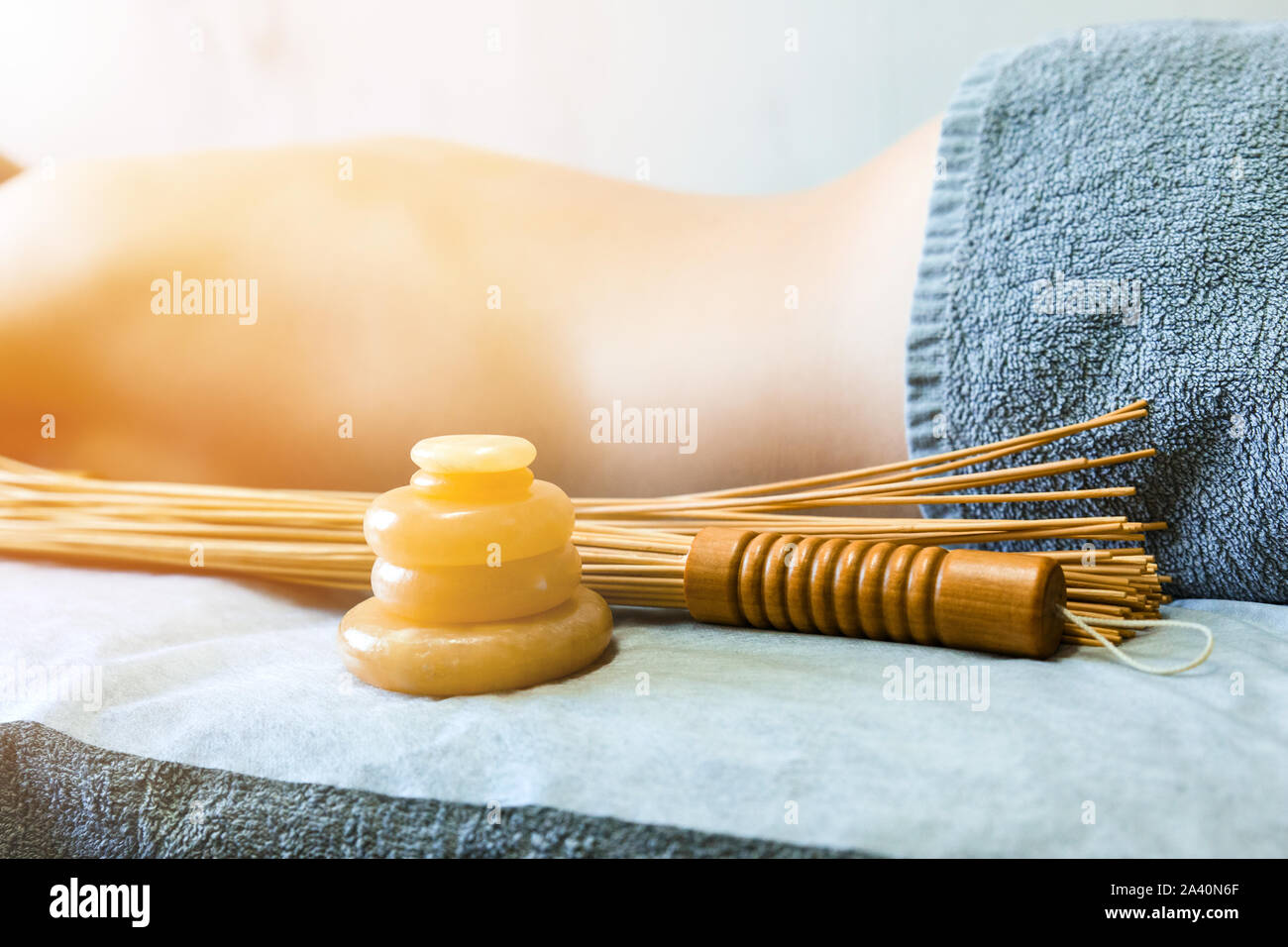 Massage accessories. Stone yellow jade and bamboo beaters for massage ...