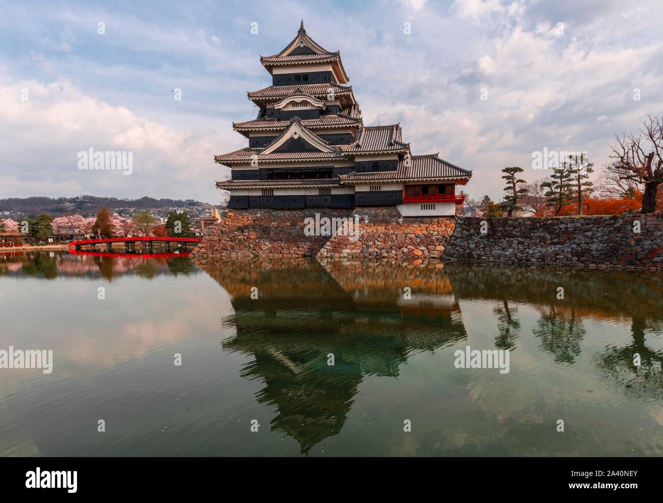 Old Japanese castle reflected in the moat, Matsumoto Castle, Matsumoto ...