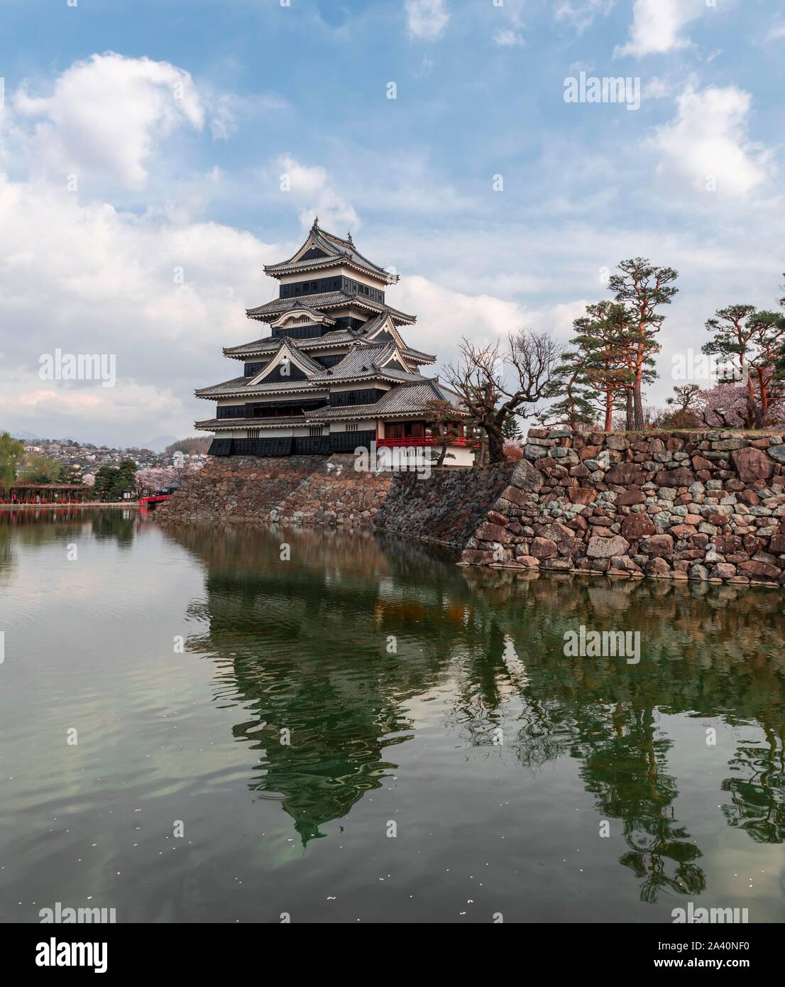 Old Japanese castle reflected in the moat, Matsumoto Castle, Matsumoto ...