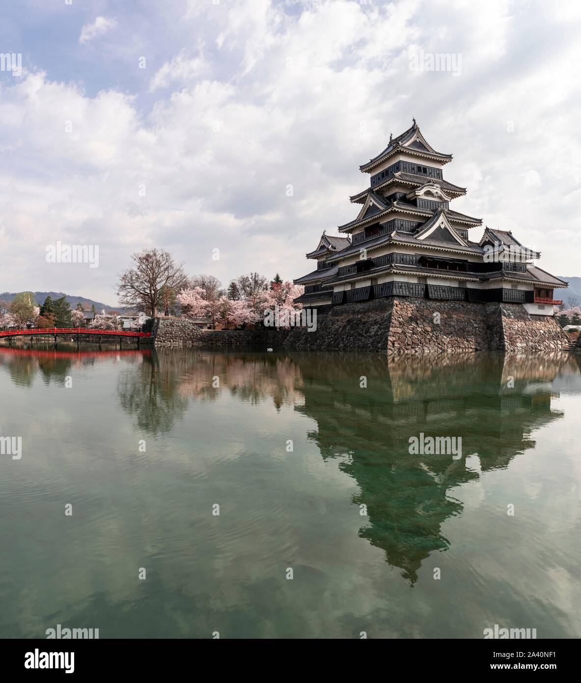 Old Japanese castle reflected in the moat, Matsumoto Castle, Matsumoto ...