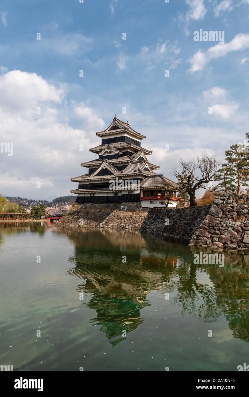Old Japanese castle reflected in the moat, Matsumoto Castle, Matsumoto ...