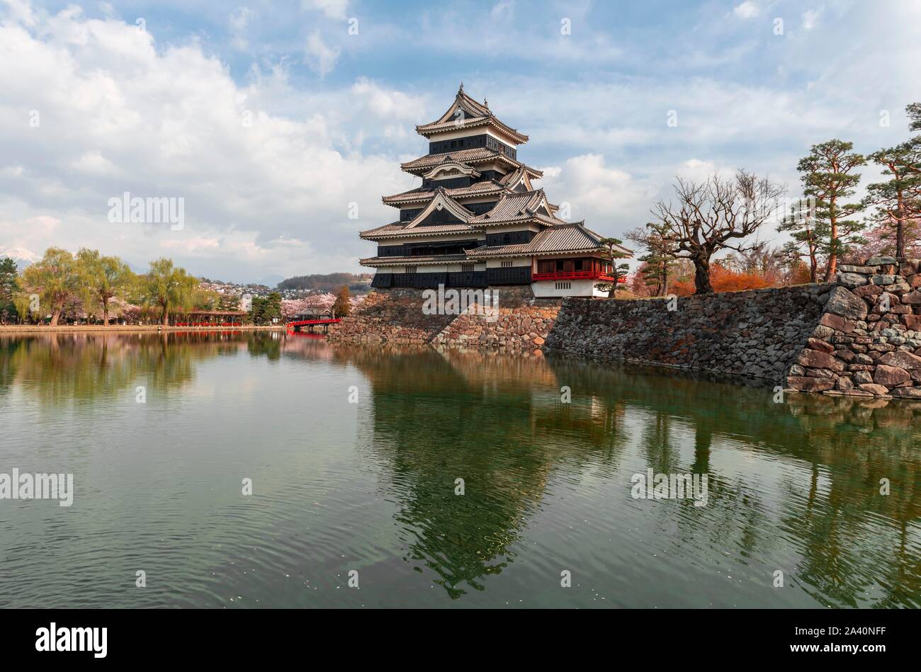 Old Japanese castle reflected in the moat, Matsumoto Castle, Matsumoto ...