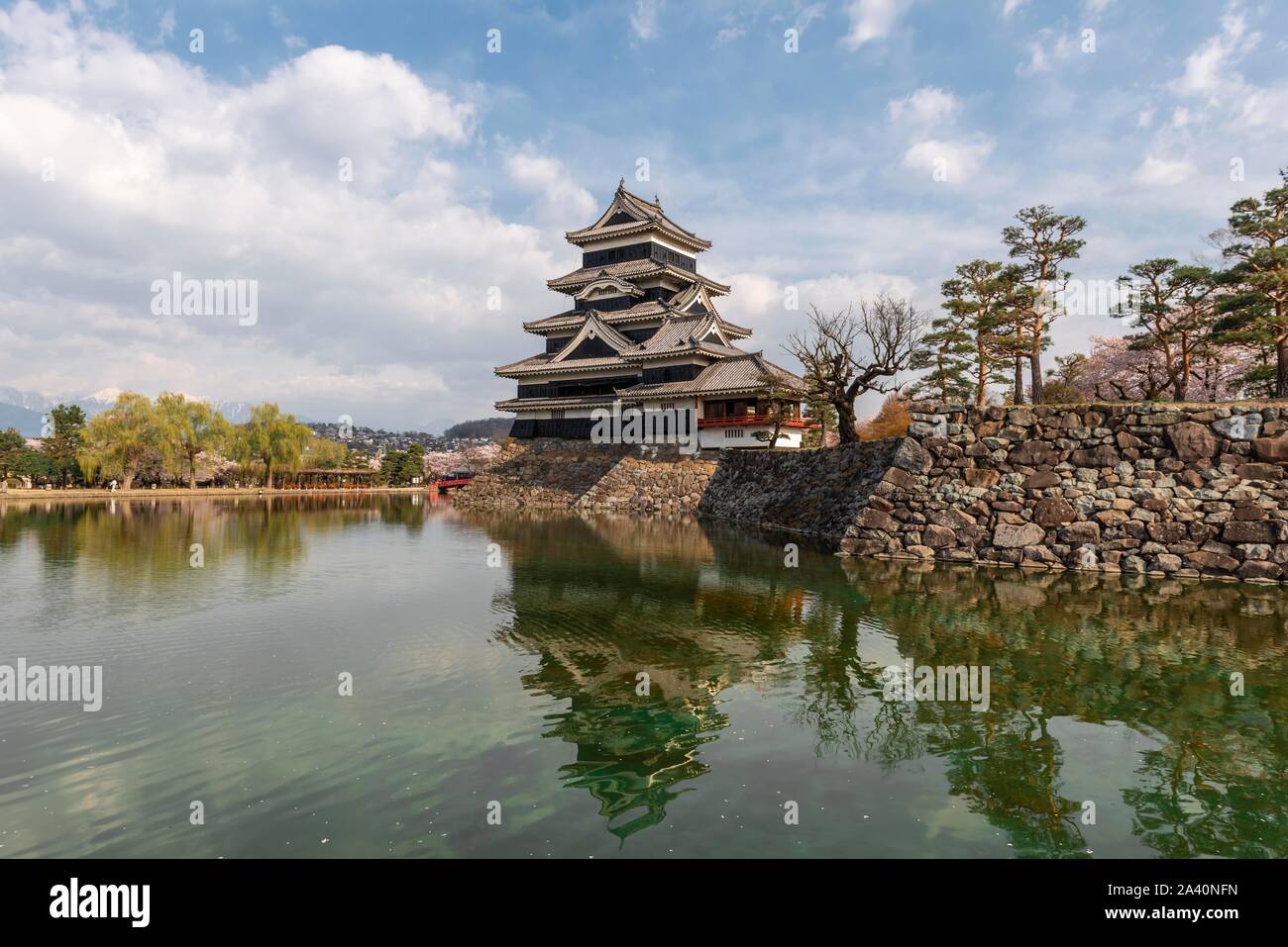 Old Japanese castle reflected in the moat, Matsumoto Castle, Matsumoto ...