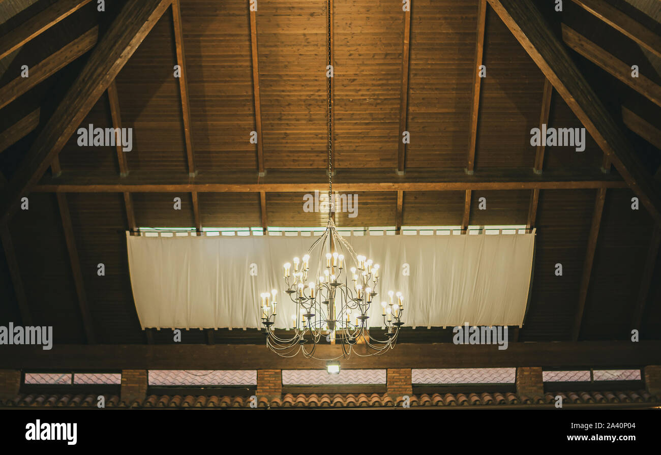 Wooden ceiling with chandelier in event hall in Spain Stock Photo - Alamy