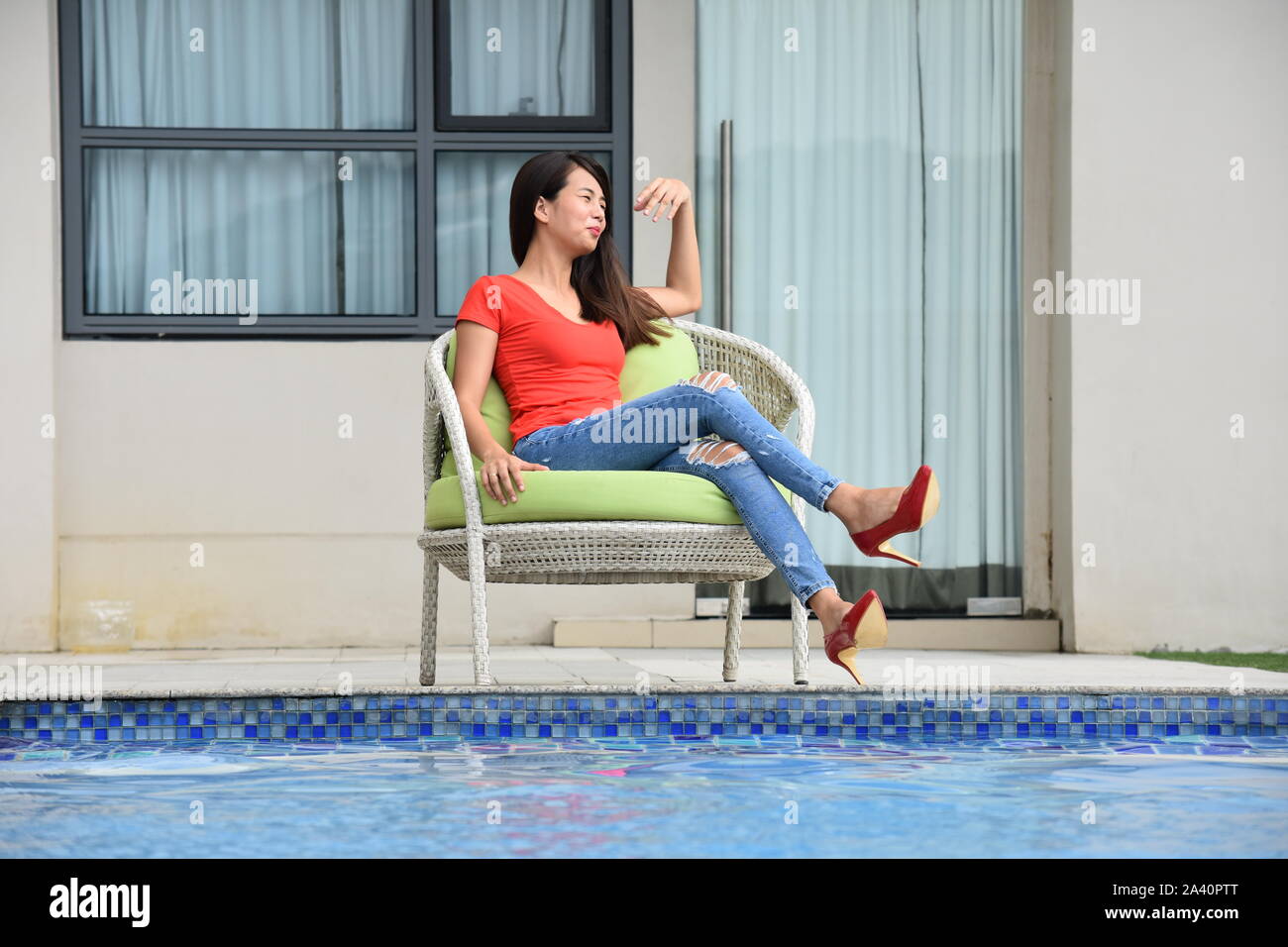Filipina Female Having Fun Sitting Stock Photo - Alamy