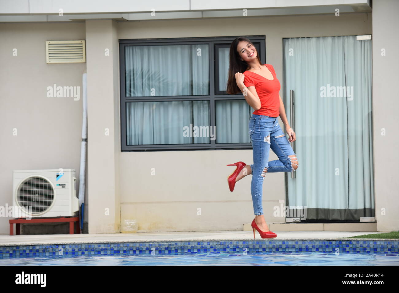 Filipina Female Having Fun Standing By Condo Stock Photo - Alamy