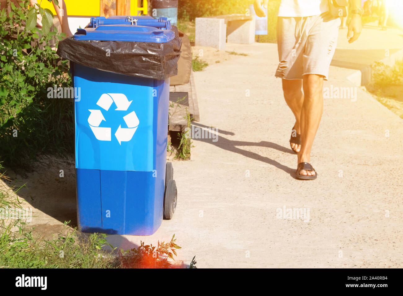 Garbage collection. Waste recycling concept. Blue containers for ...