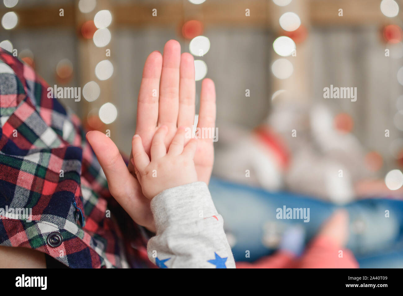 New Year's palm of the baby and mom. New born baby hand in mom palm ...