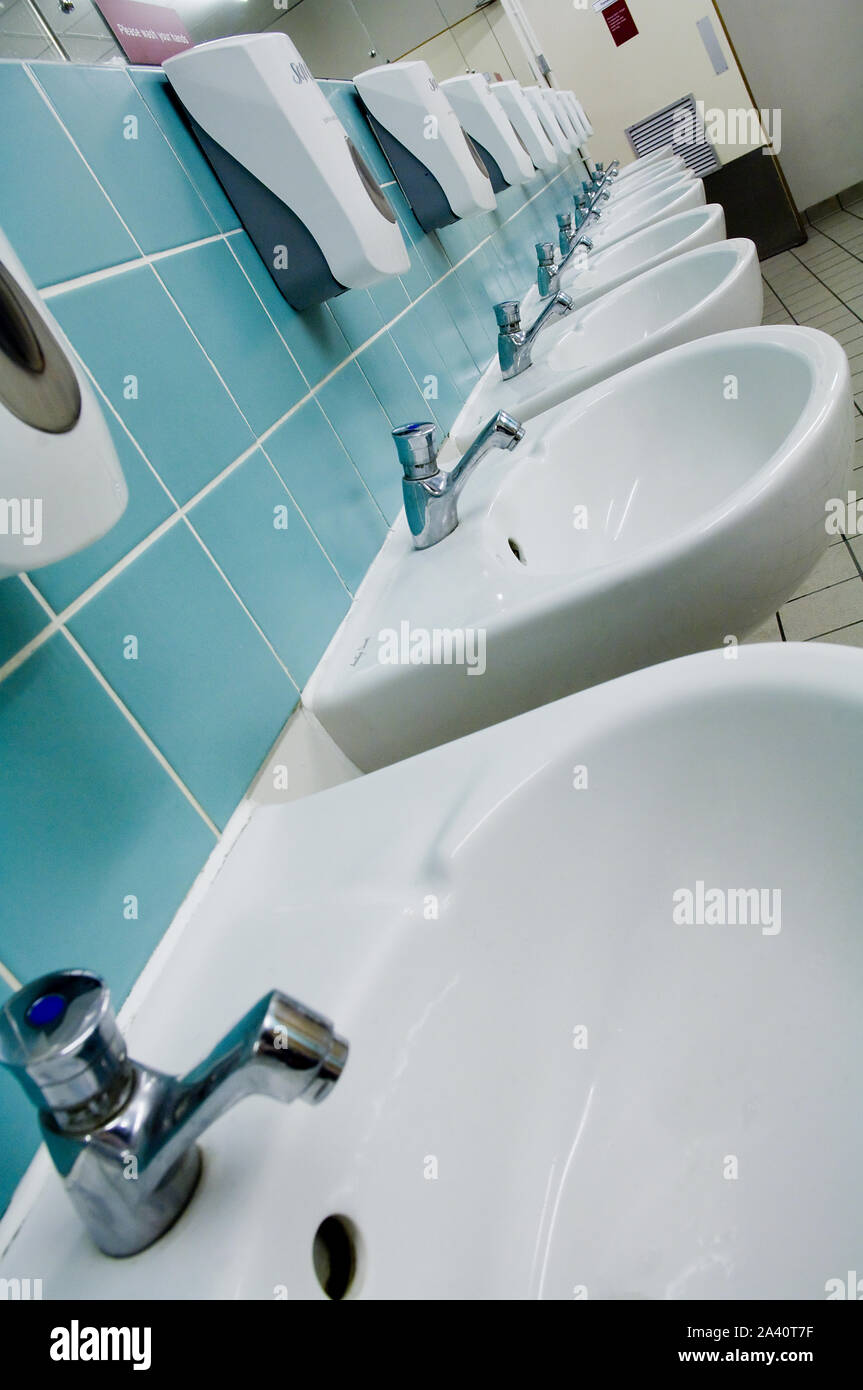 A row of sinks in a public bathroom Stock Photo - Alamy