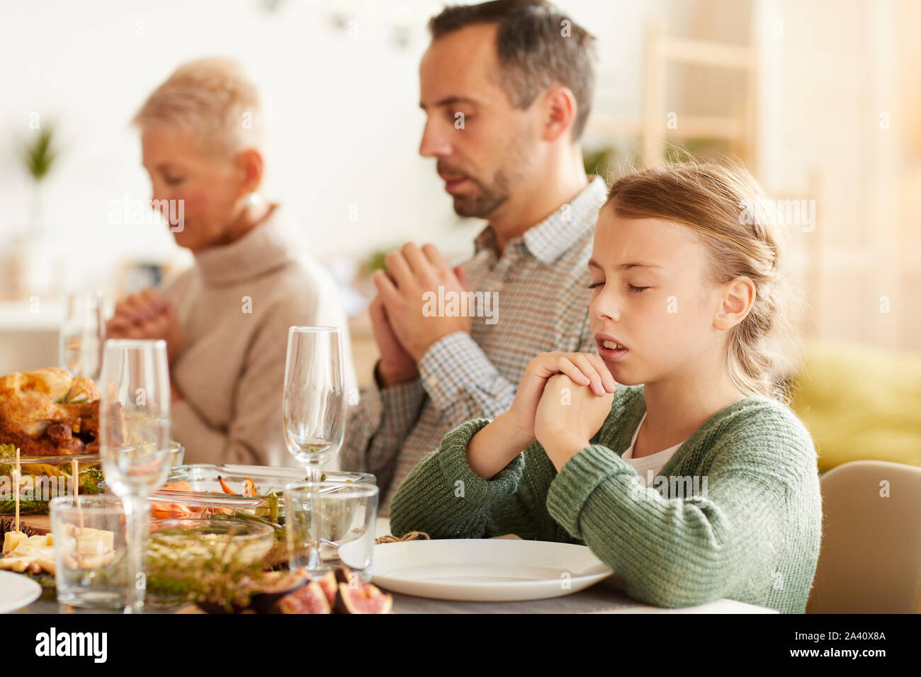 Family praying together meal dining hi-res stock photography and images ...