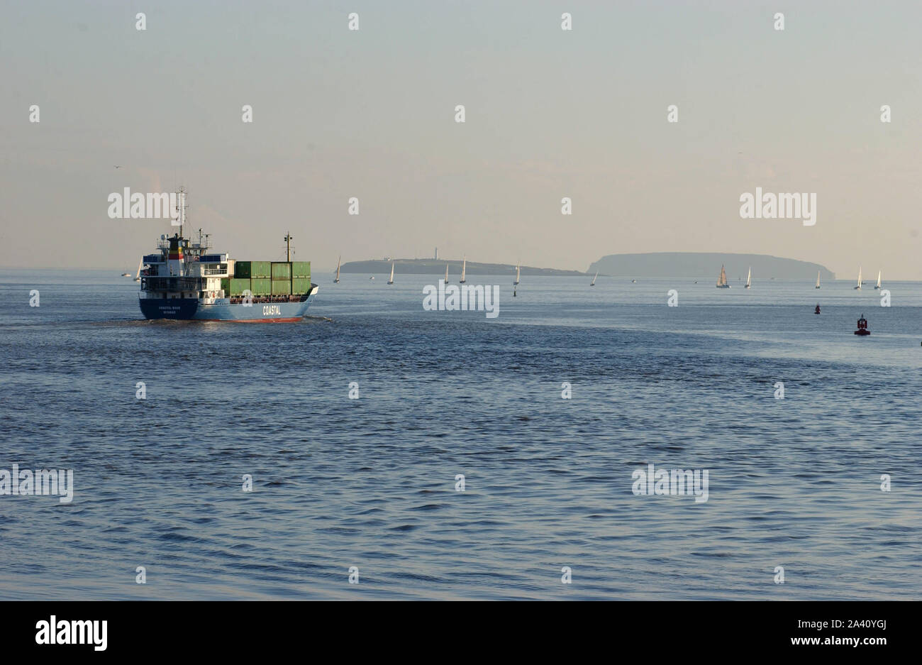 A container ship leaves Cardiff Docks for the Bristol Channel, South ...