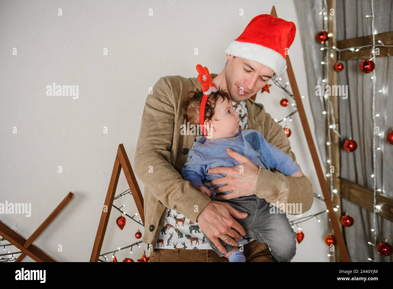 baby and father on christmas background. happy family father and child ...