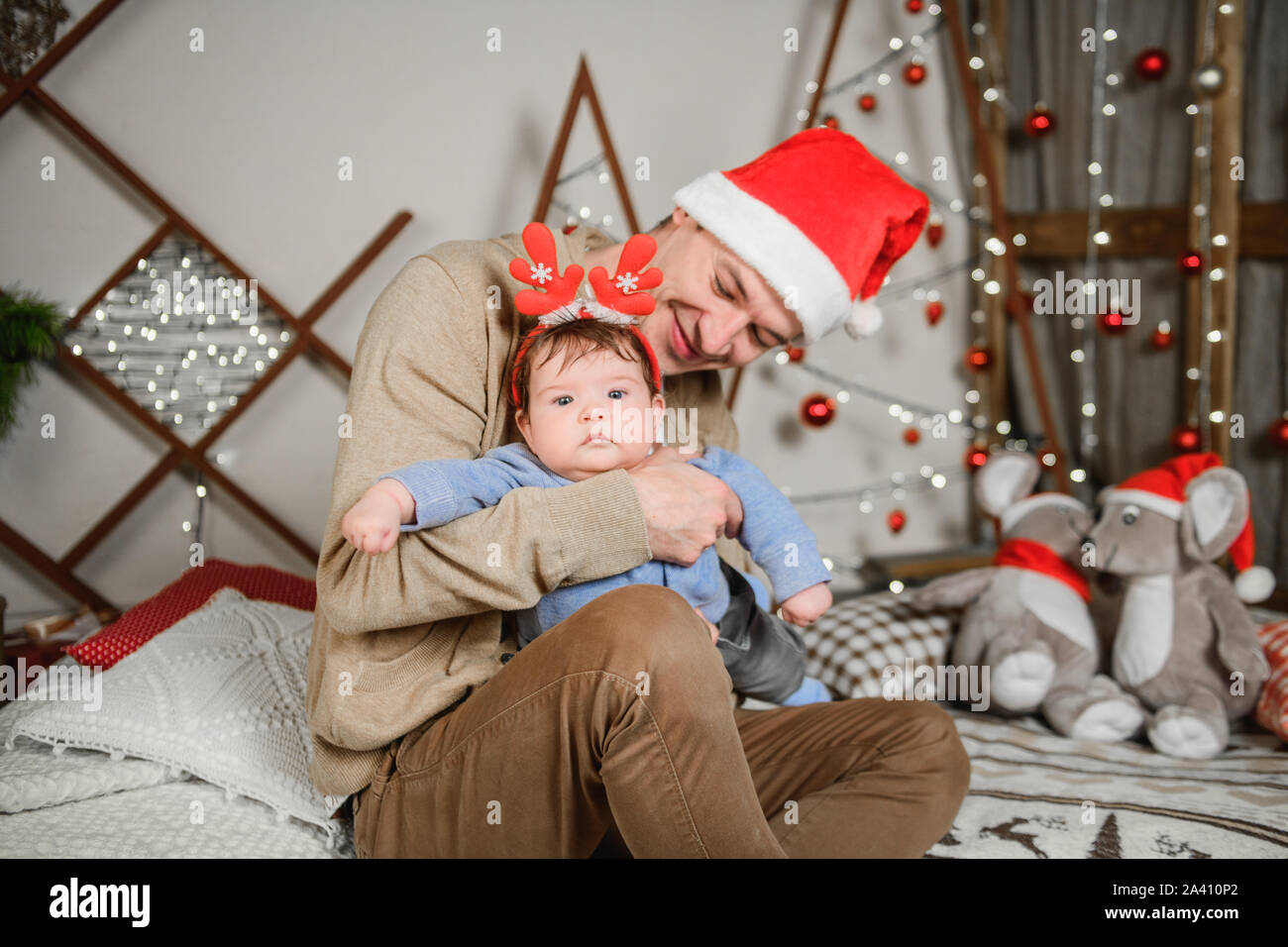 baby and father on christmas background. happy family father and child ...