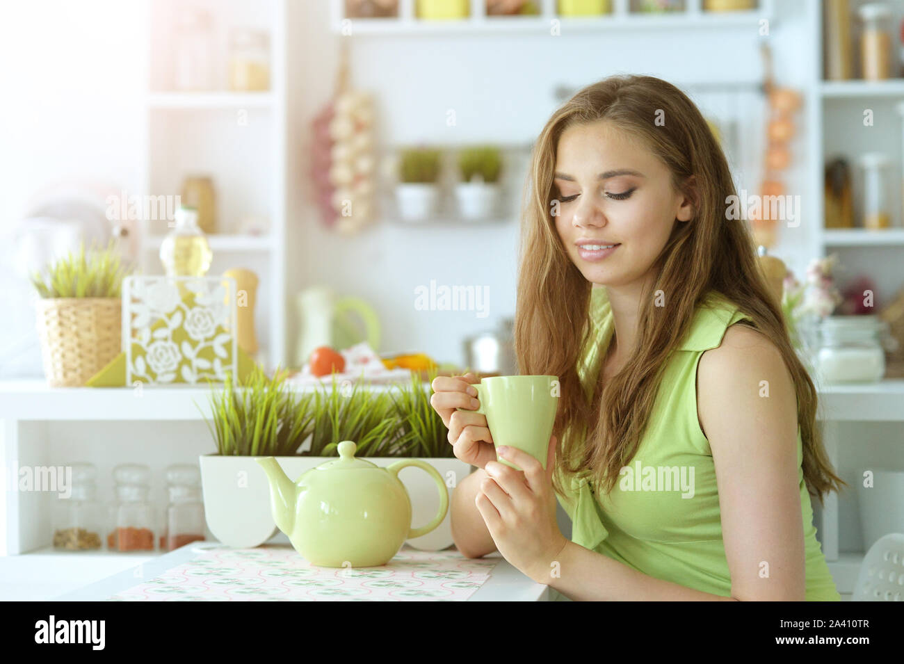 Cute girl drinking tea and taking selfie Stock Photo - Alamy