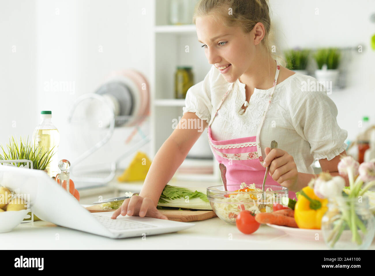 Close up portrait of cute girl cooking on kitchen Stock Photo - Alamy