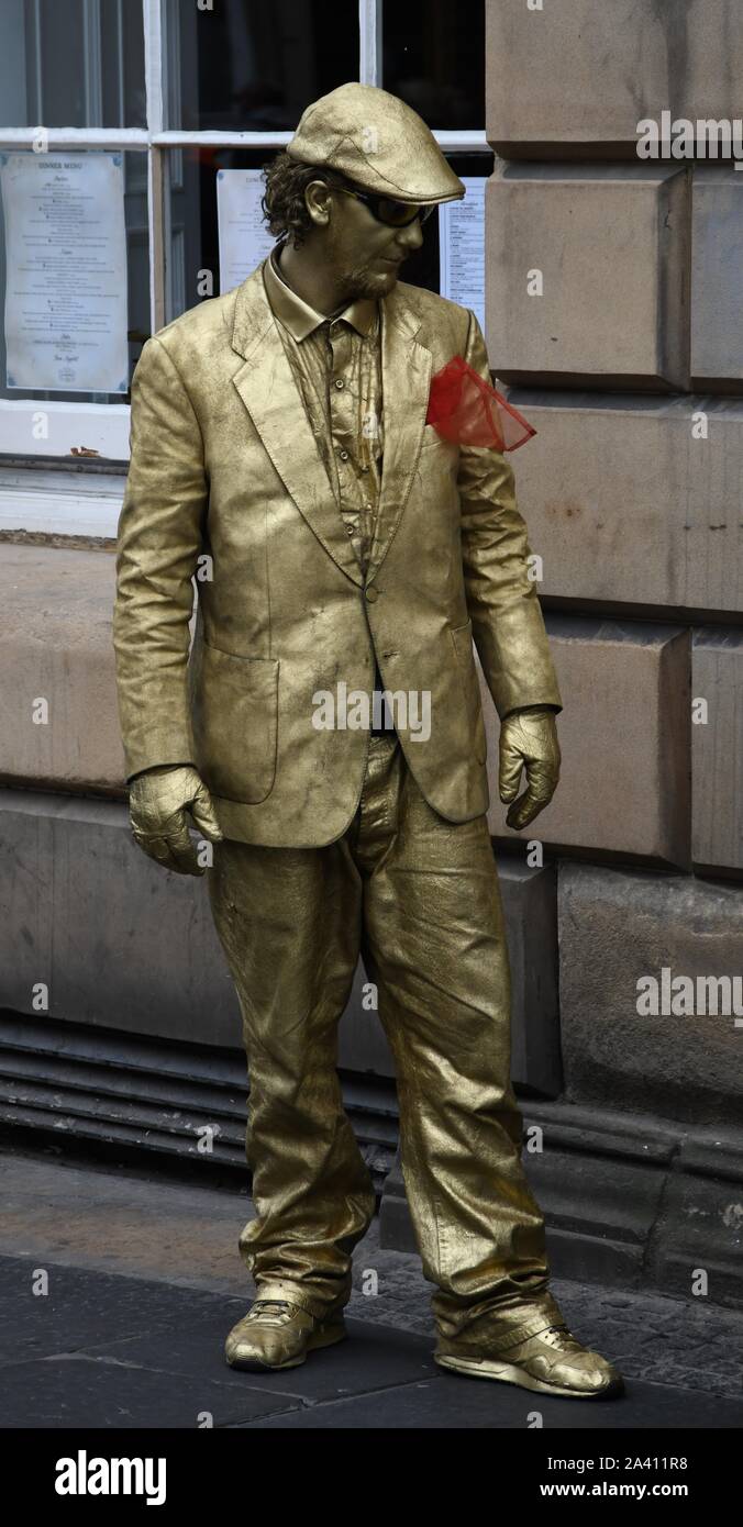 The Golden man human Statue on the Royal Mile Edinburgh Stock Photo - Alamy