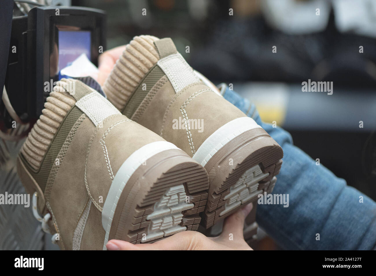 Woman boots counter hi-res stock photography and images - Alamy