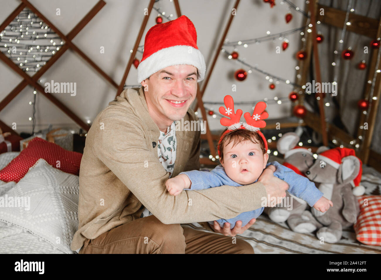 baby and father on christmas background. happy family father and child ...