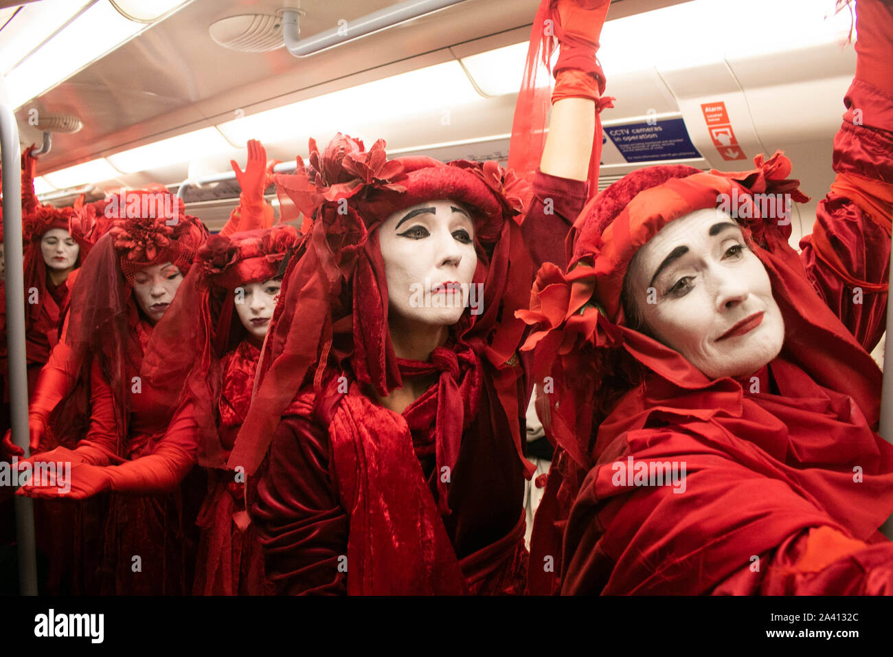 London, UK - 11 October 2019. Red Rebels from Extinction Rebellion ...