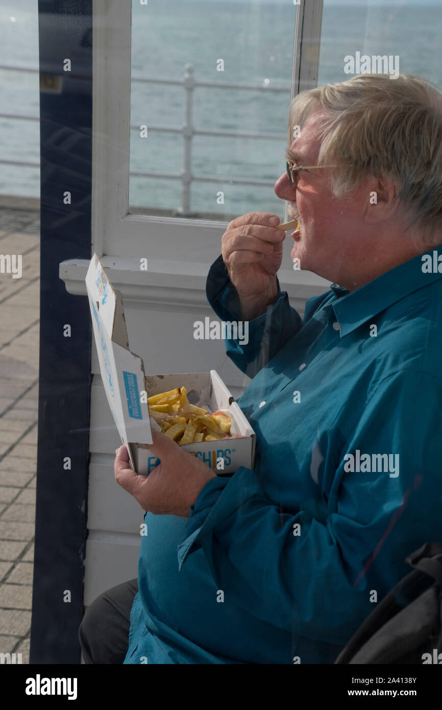 Man eating fish hi-res stock photography and images - Alamy