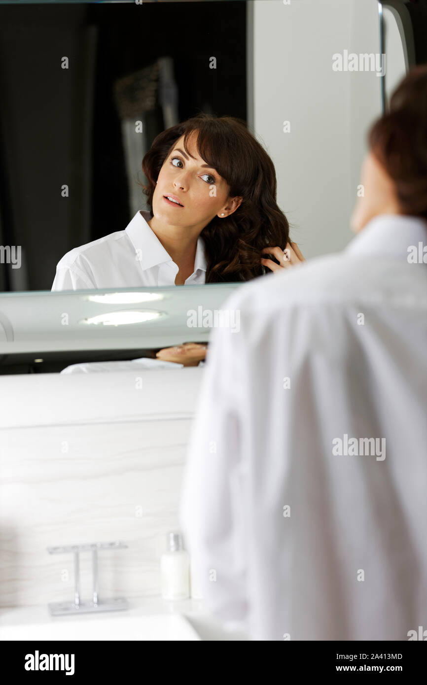 Beautiful young woman getting ready in her bathroom Stock Photo - Alamy