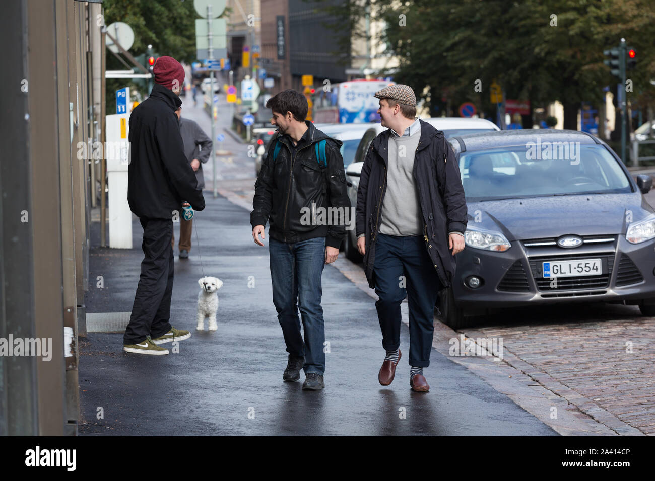 Men outdoors walking in a street in city centre Stock Photo - Alamy