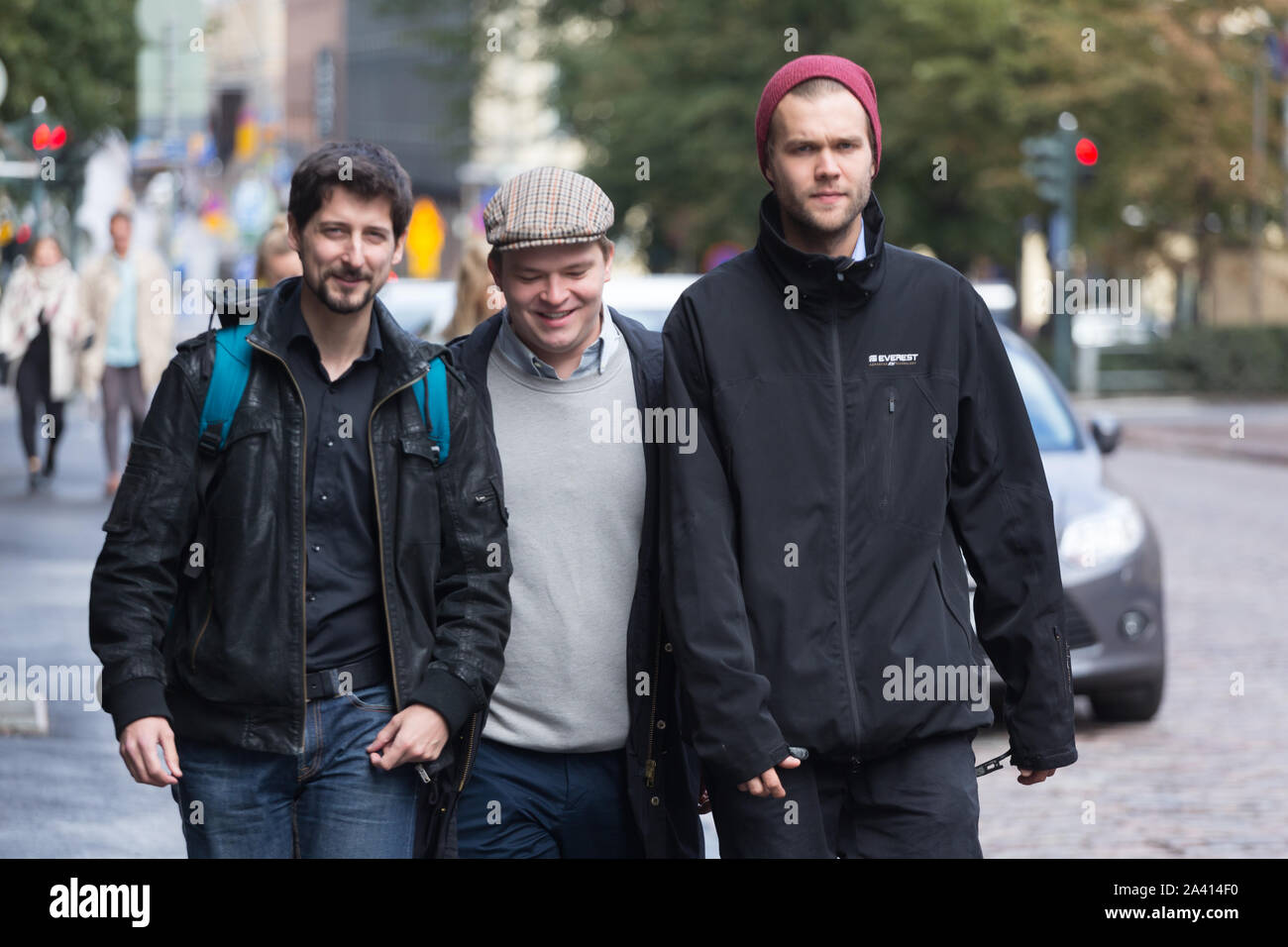 Men outdoors walking in a street in city centre Stock Photo - Alamy
