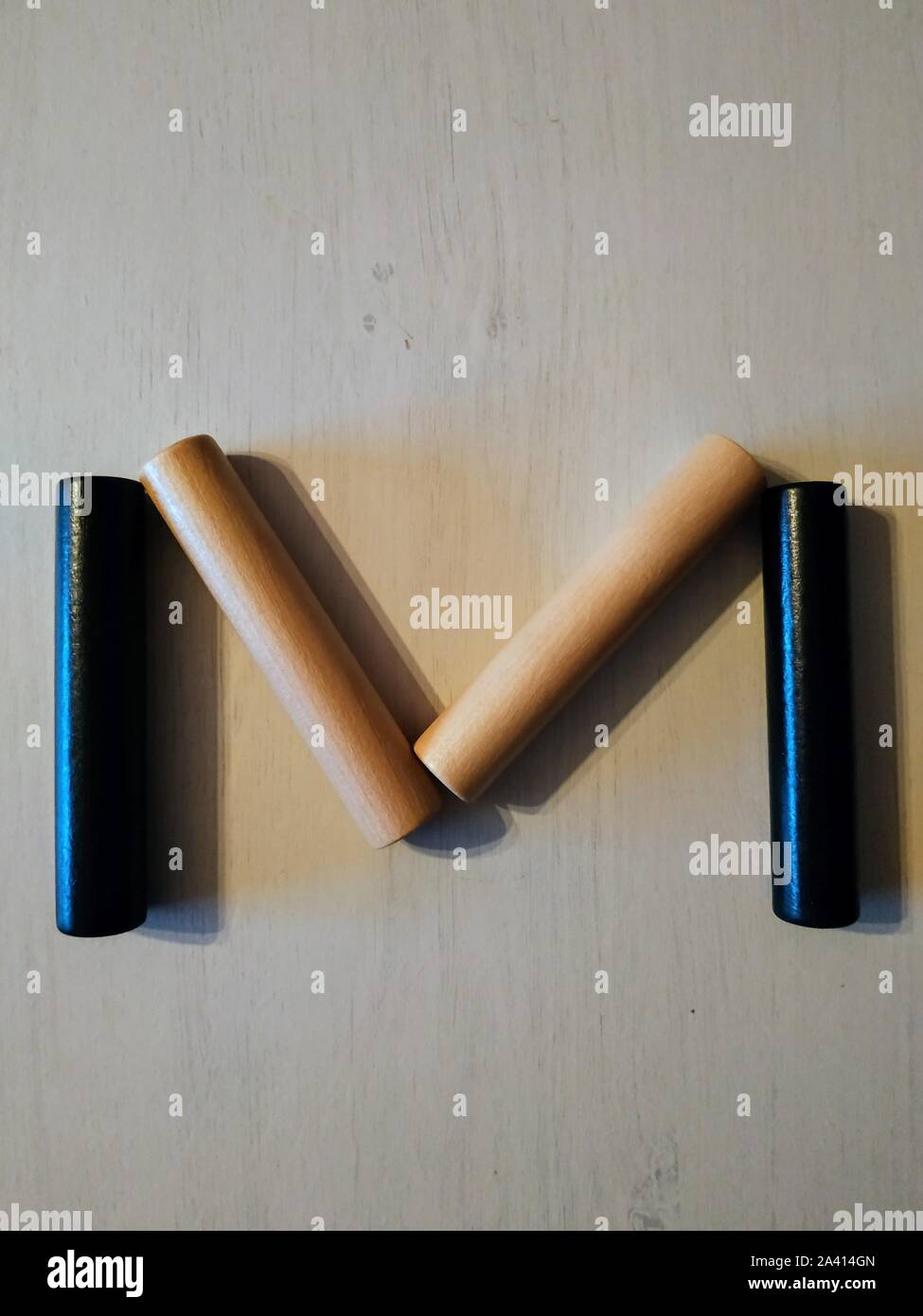 M wood stick letter design concept Stock Photo - Alamy