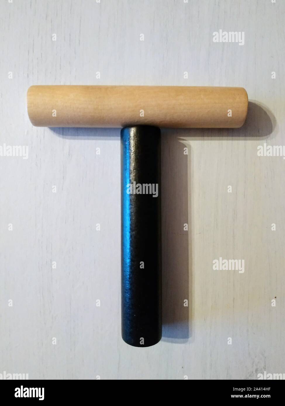 T wood stick letter design concept Stock Photo - Alamy