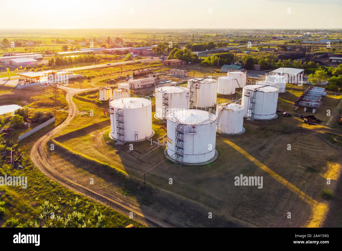 Tanks with petroleum products are among the fields near the village ...