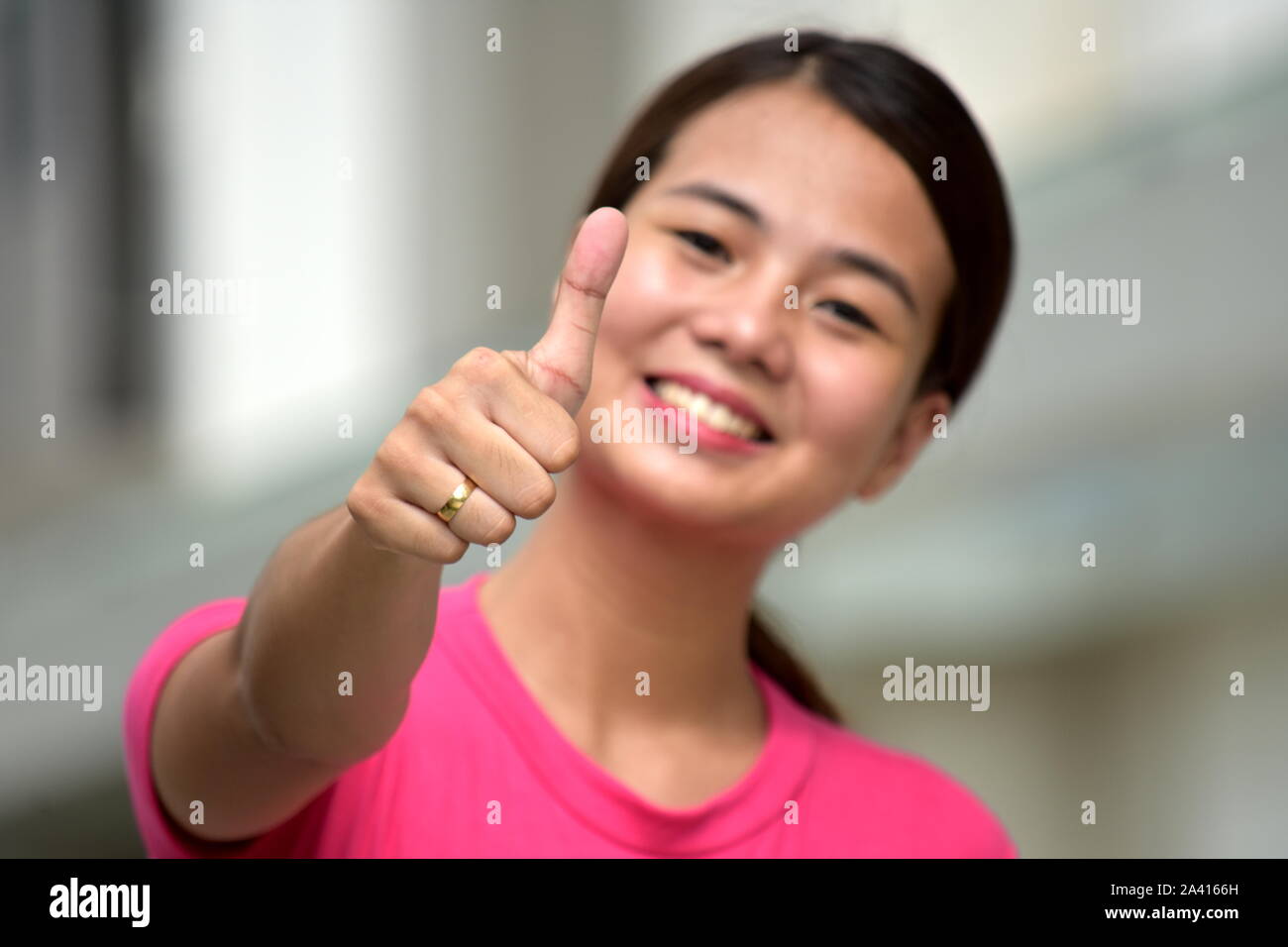 Female With Thumbs Up Stock Photo - Alamy