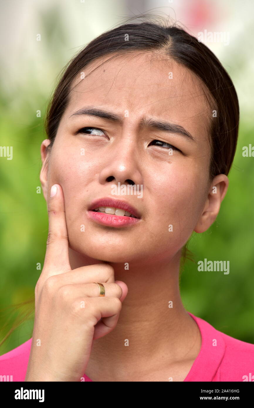 Filipina Female Thinking Stock Photo - Alamy