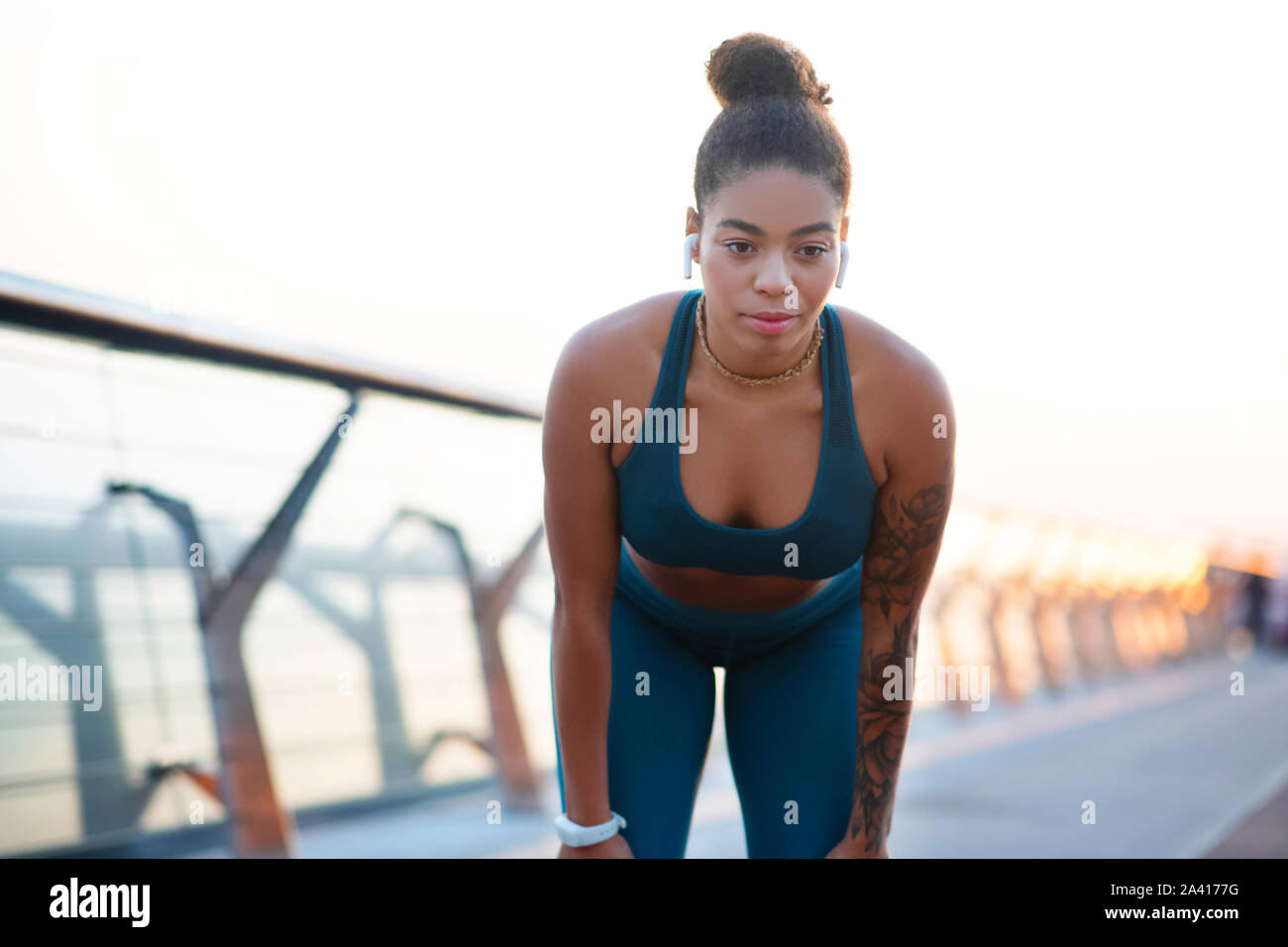 Dark-skinned woman stopping for a moment after intensive run Stock ...
