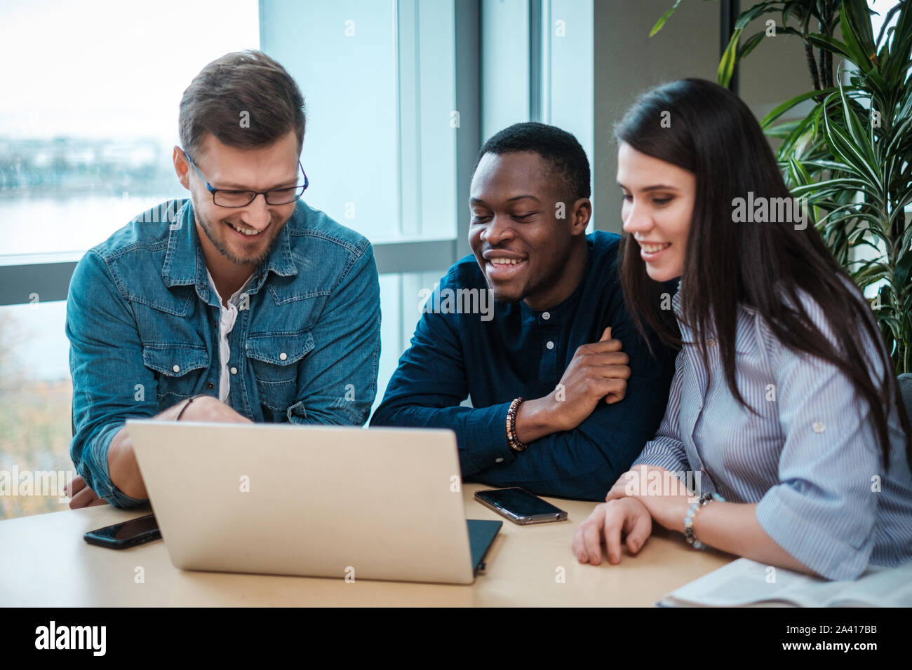 Multicultural group of students studying in a public library Stock ...