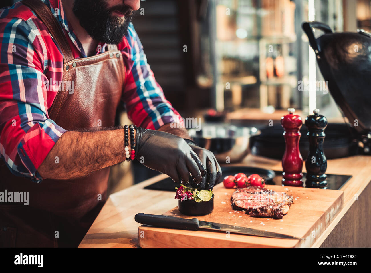 Chef serving freshly cooked meat in a restaurant Stock Photo - Alamy