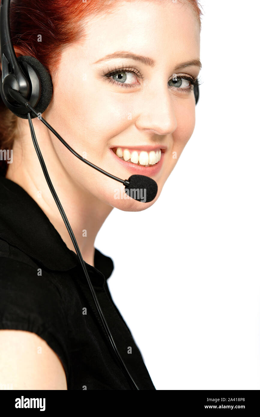 Professional woman talking on a headset in her office at work. With ...