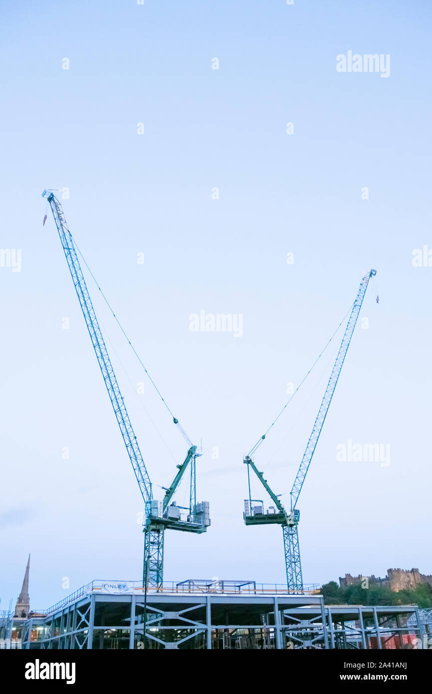 Two cranes in the construction site of the Riverwalk development in ...