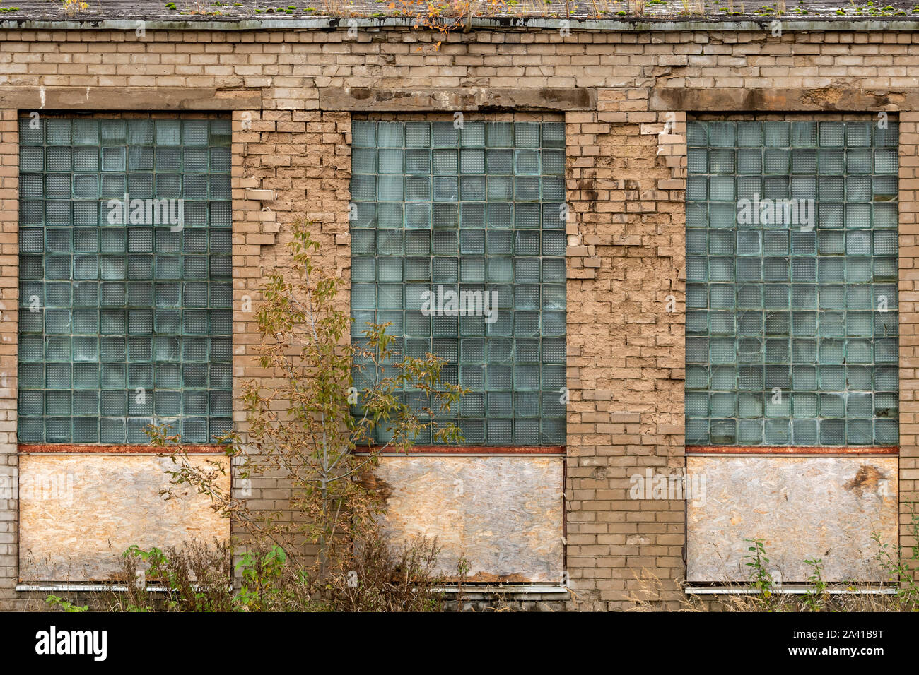 Big windows in an old abandoned industrial building Stock Photo - Alamy