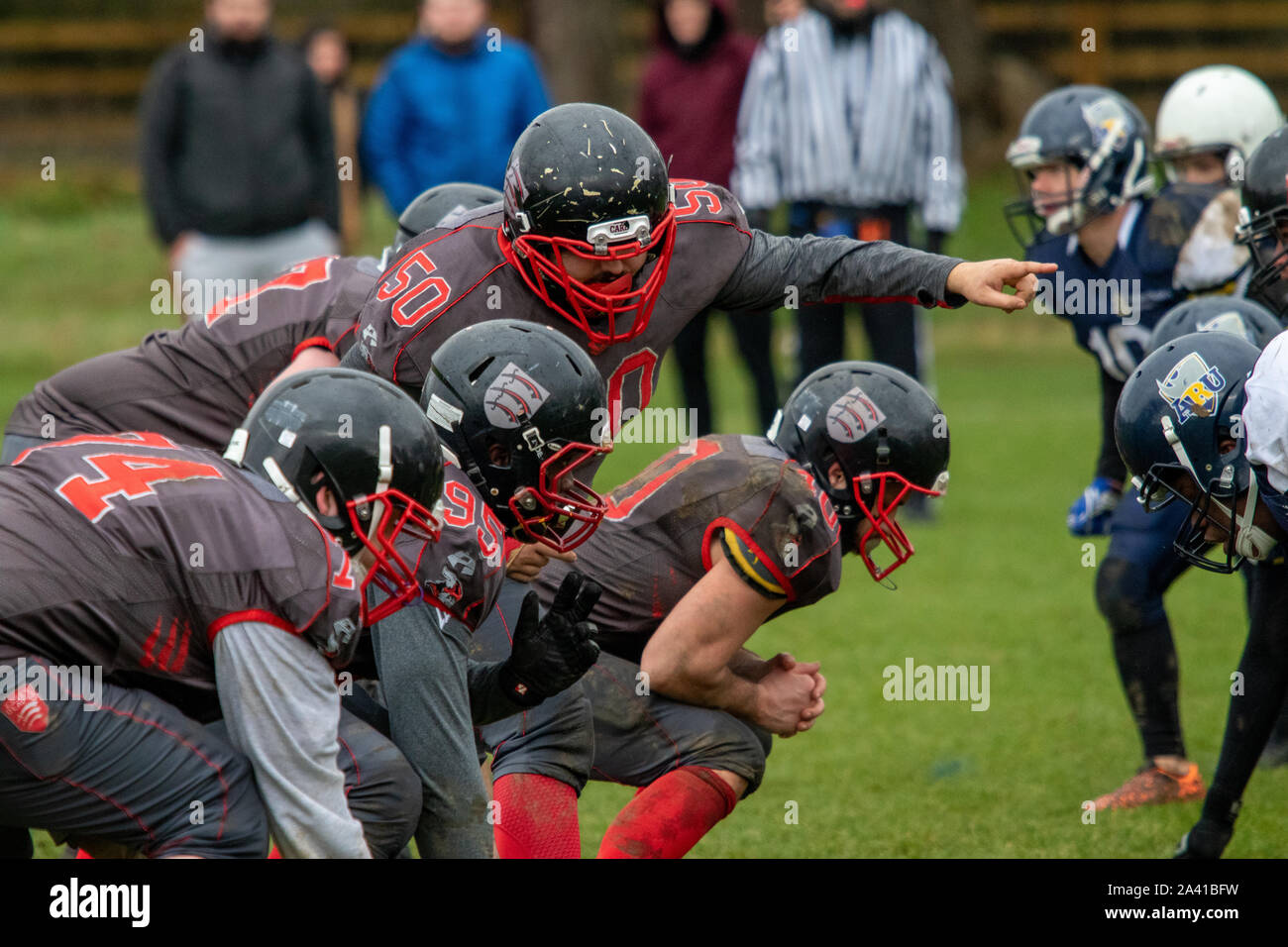On the line of scrimmage a player points Stock Photo - Alamy