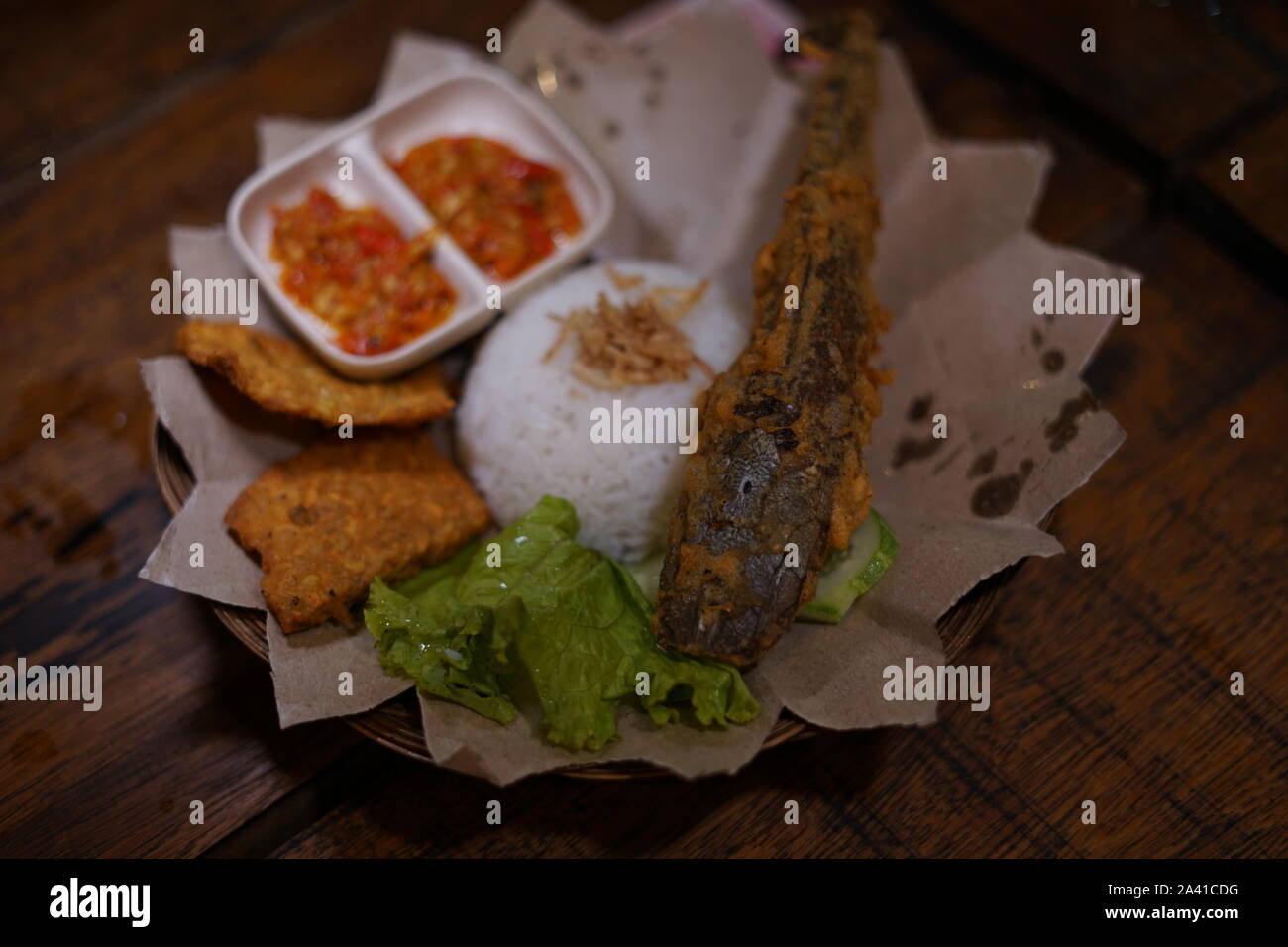 Indonesian Fried catfish or Pecel Lele with rice and spicy sambal Stock ...