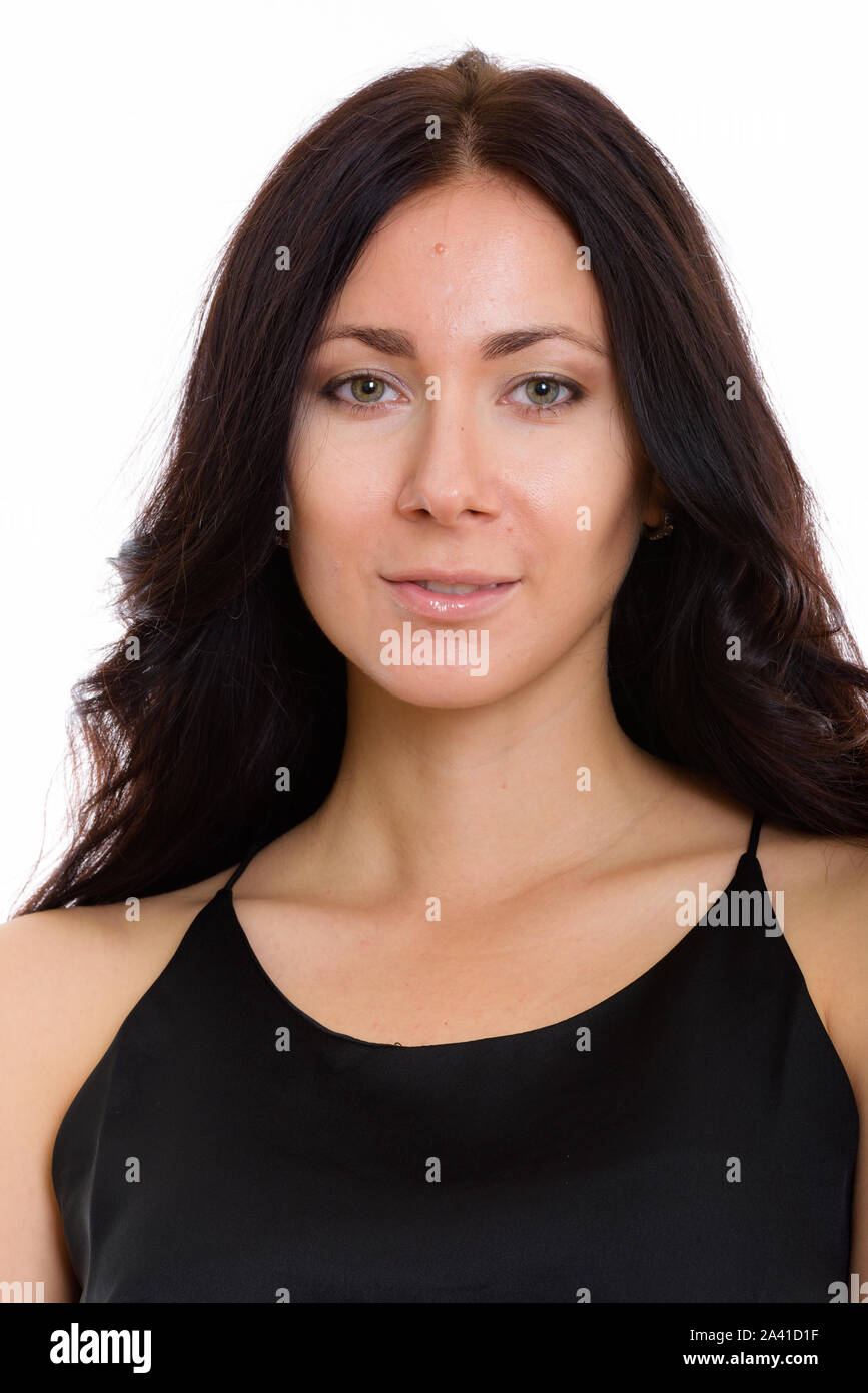 Studio portrait of beautiful young woman isolated against white ...